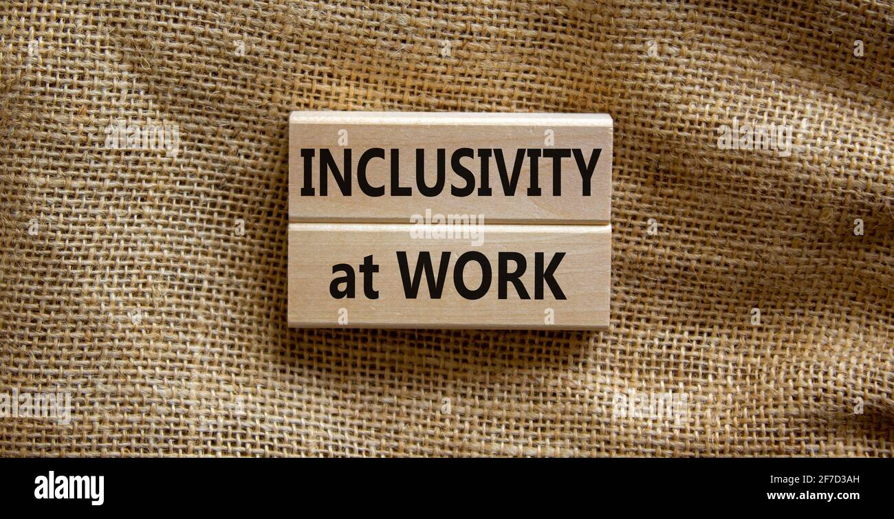 Inclusivity at work symbol. Wooden blocks with words 'Inclusivity at ...