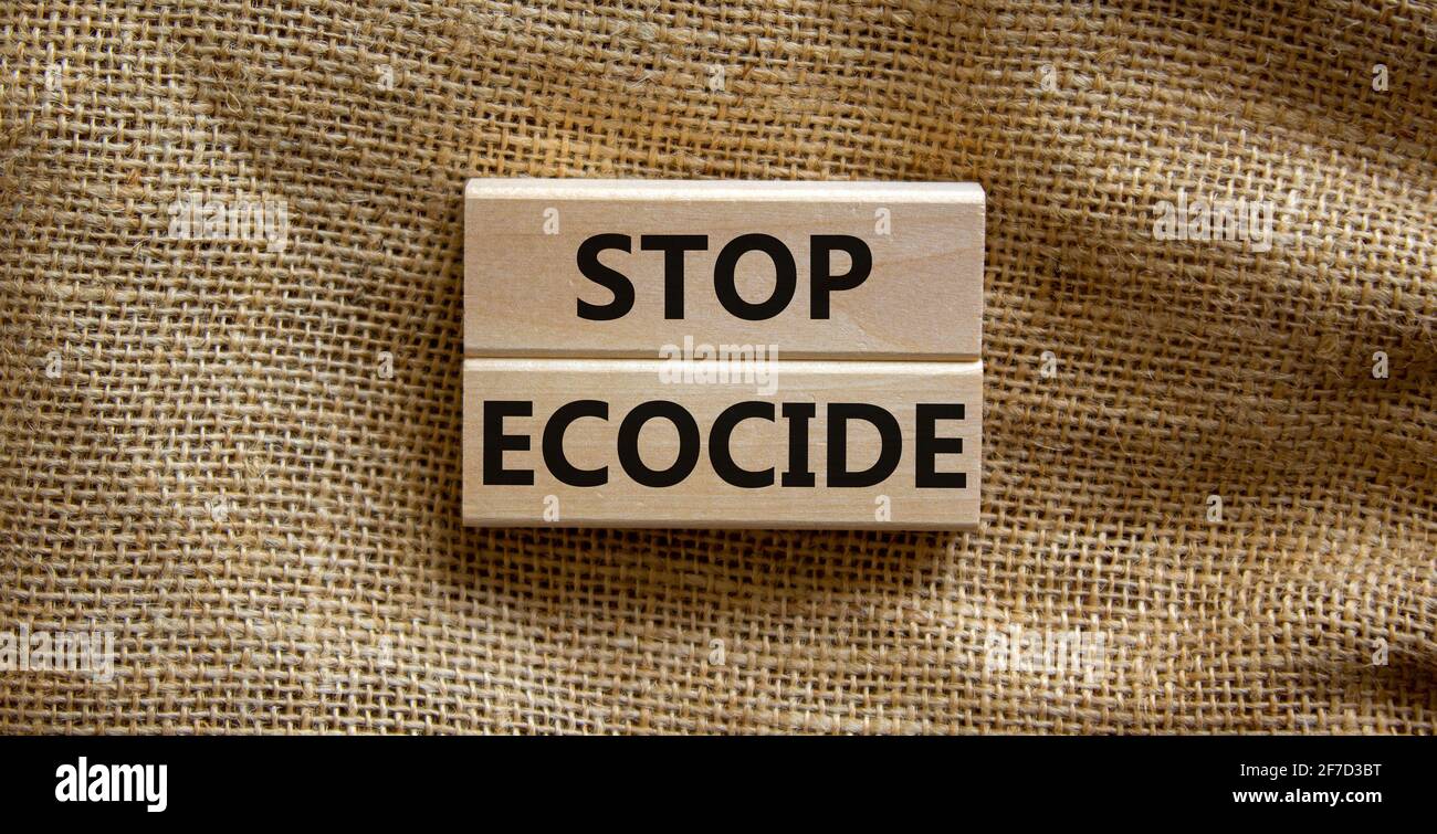 Stop ecocide symbol. Wooden blocks with words stop ecocide. Beautiful ...