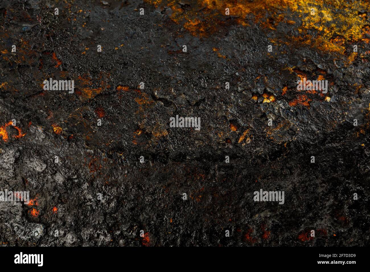 Bottom side of a cast iron pan with thicl layer of soot on it Stock ...