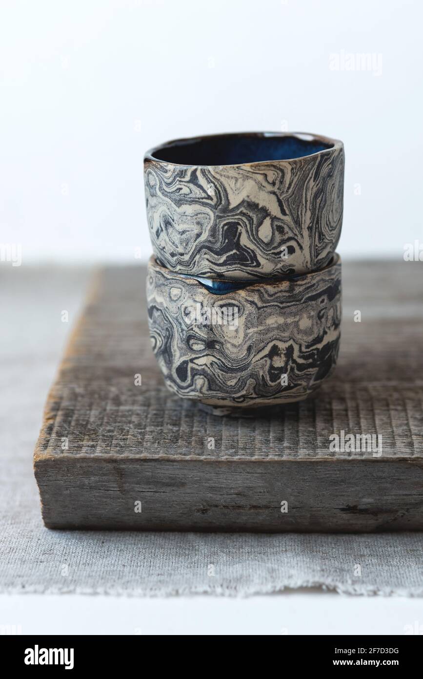 Handmade ceramic cups in the style of wabi sabi Stock Photo - Alamy