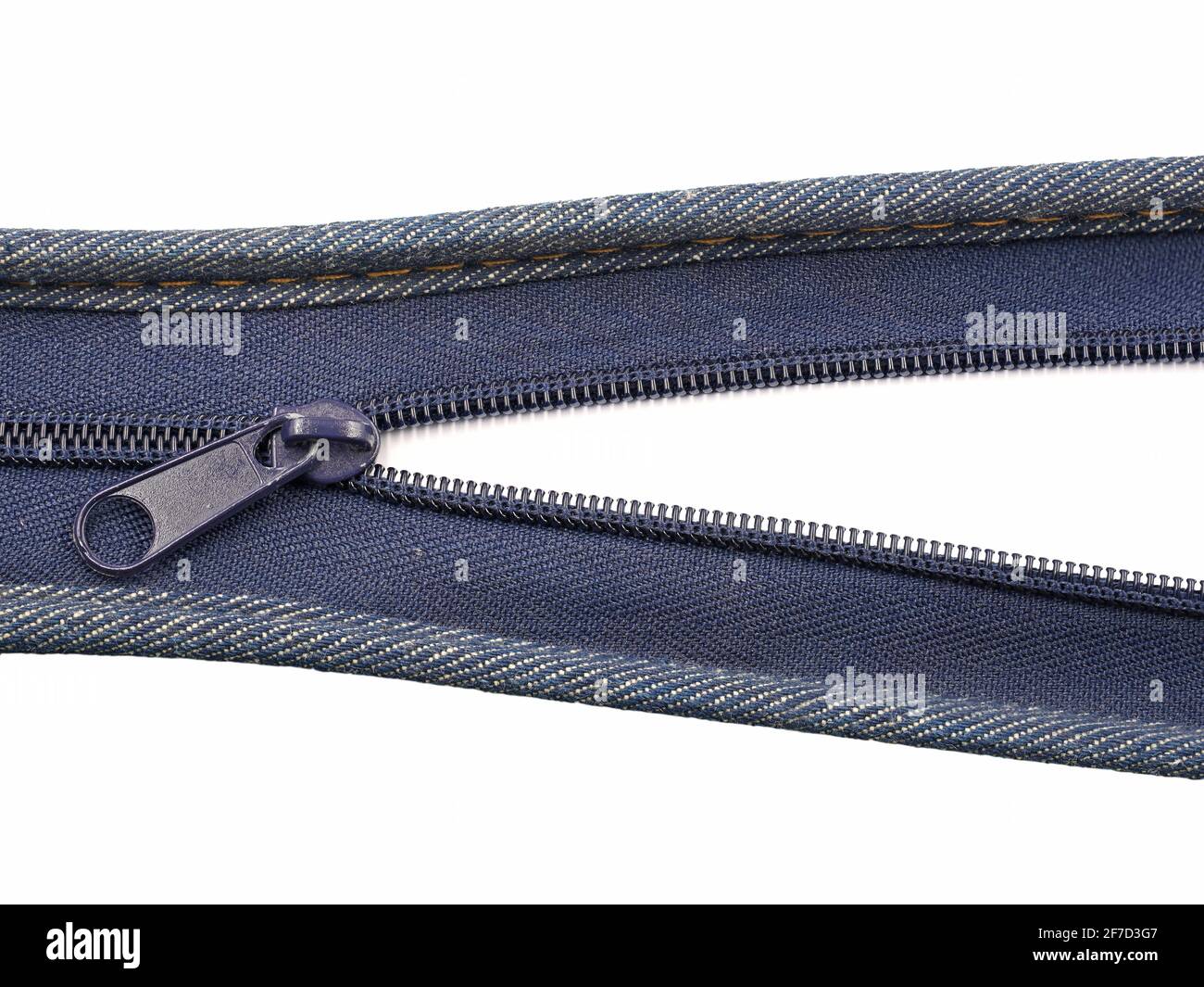 close up of half open blue zipper for clothing isolated on white ...