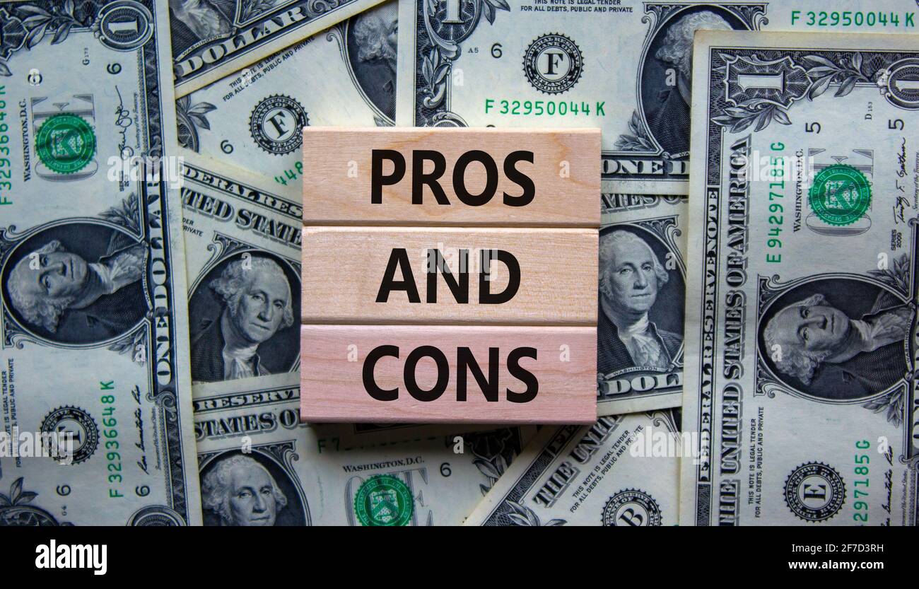 Pros and cons symbol. Wooden blocks with words 'Pros and cons ...