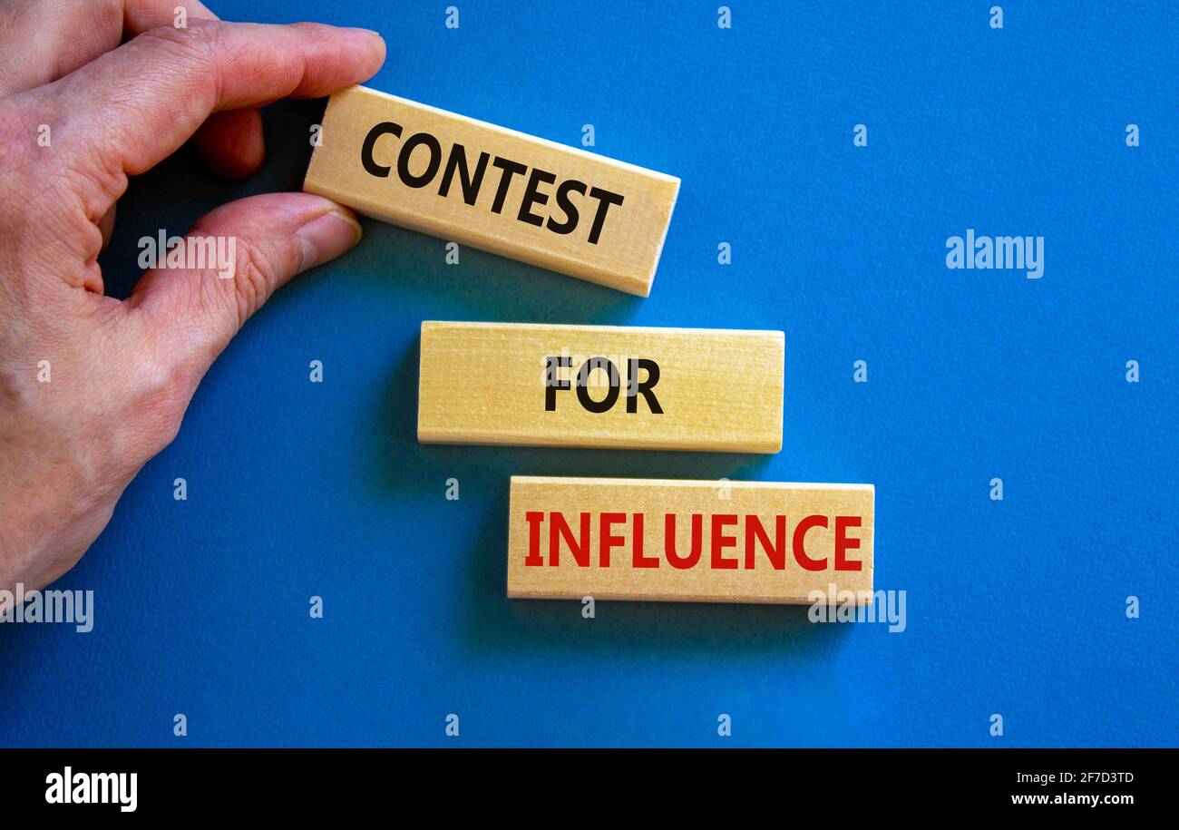 Contest for influence symbol. Wooden blocks with words 'Contest for ...