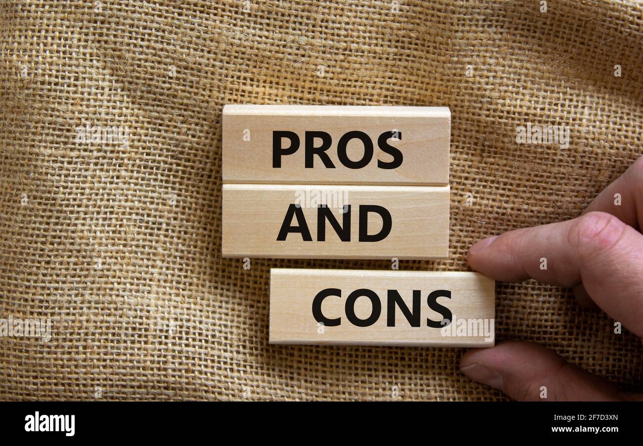 Pros and cons symbol. Wooden blocks with words 'Pros and cons ...