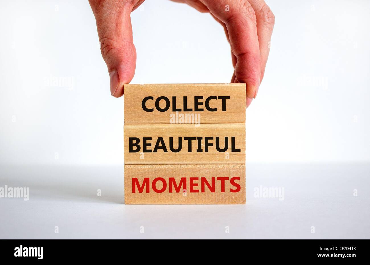 Collect beautiful moments symbol. Wooden blocks with words 'Collect ...