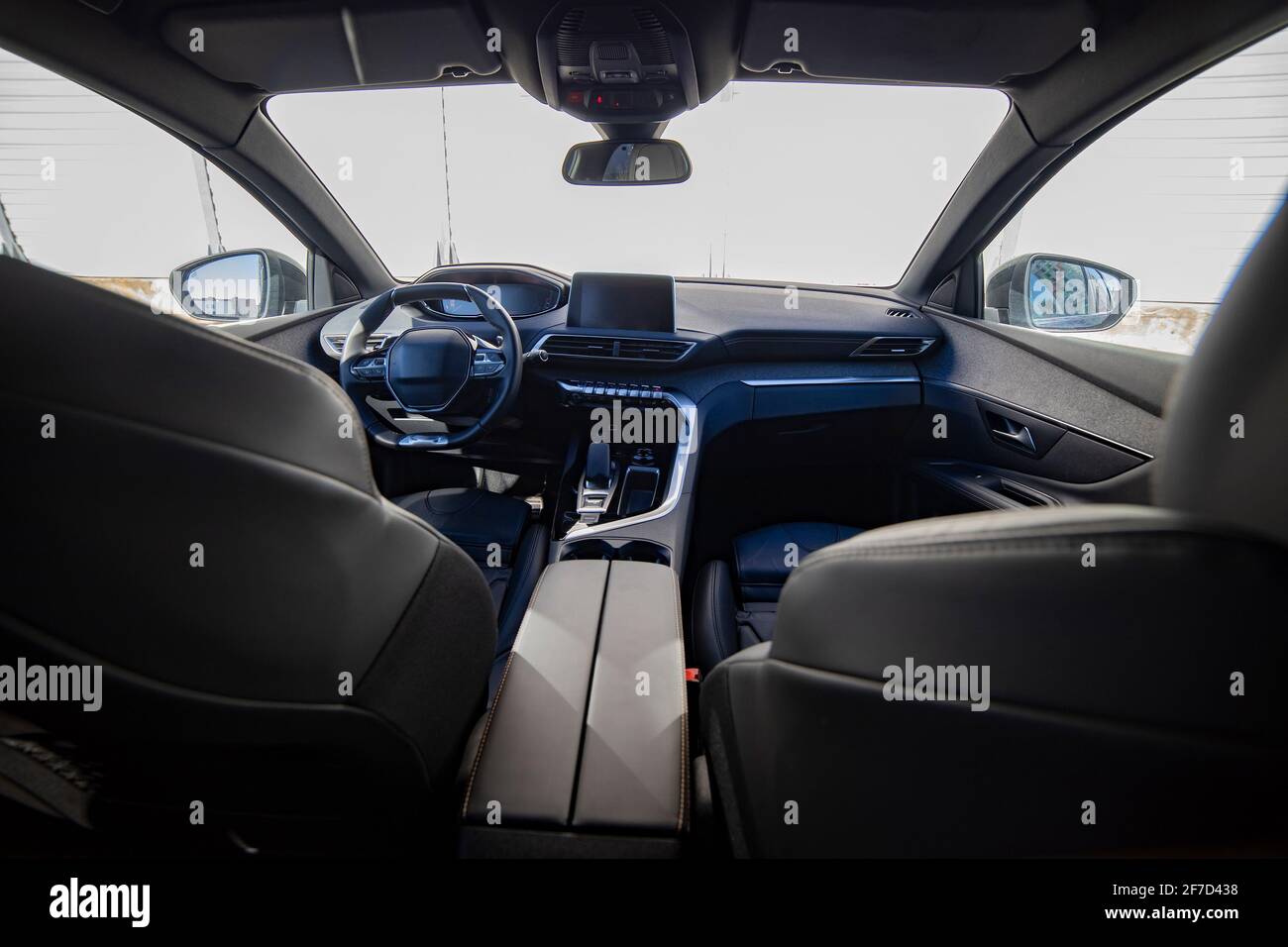 empty interior of modern premium car dark interior close-up steering ...