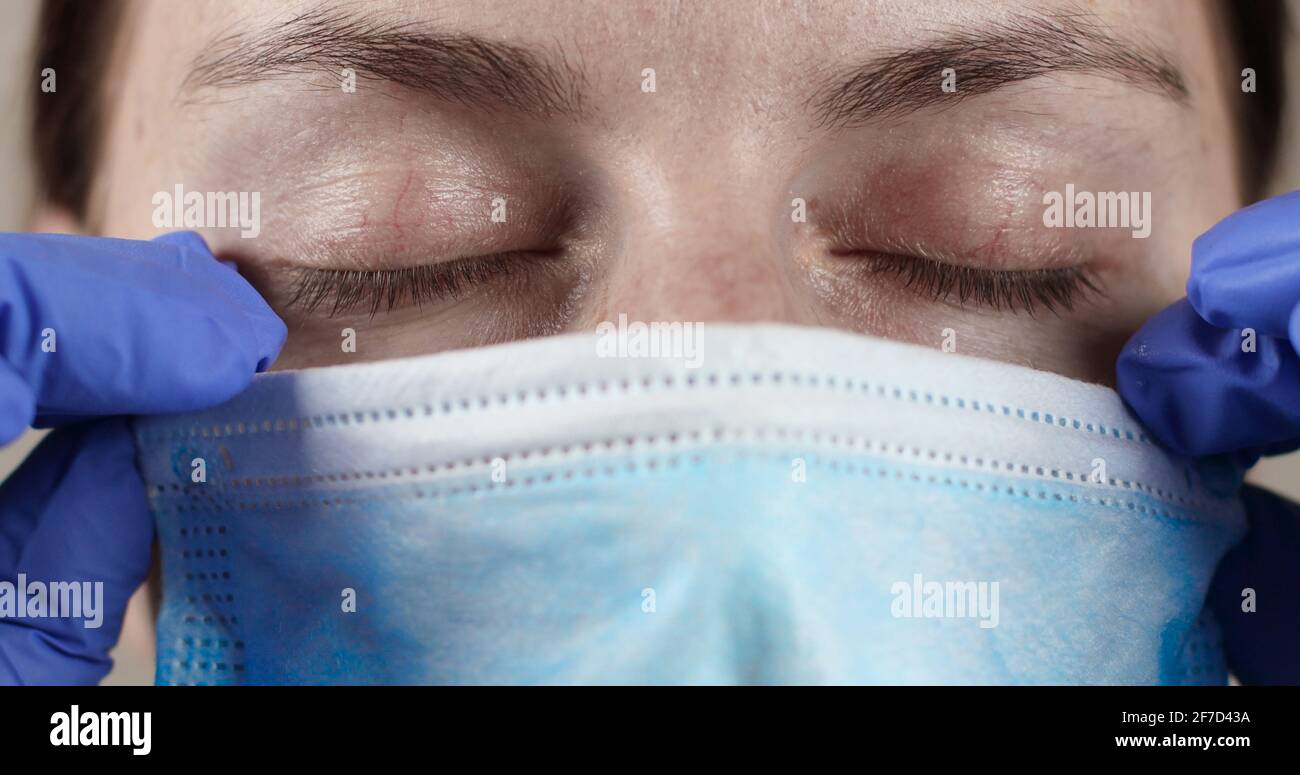 Eyes closing woman doctor hi-res stock photography and images - Alamy