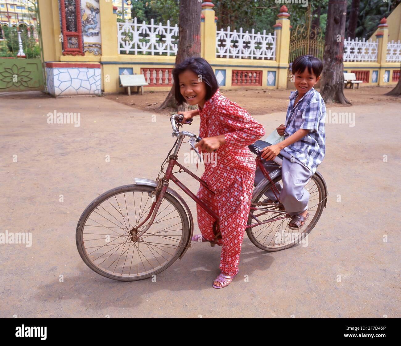 Young children riding bicycles, Ho Chi Minh City (Saigon), Socialist ...