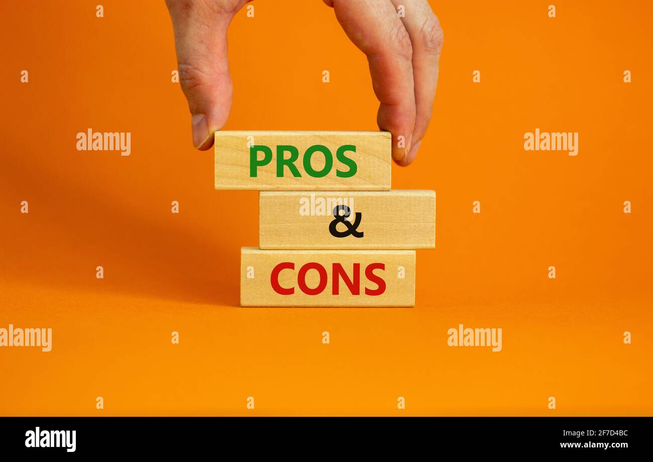 Pros and cons symbol. Wooden blocks with words 'Pros and cons ...