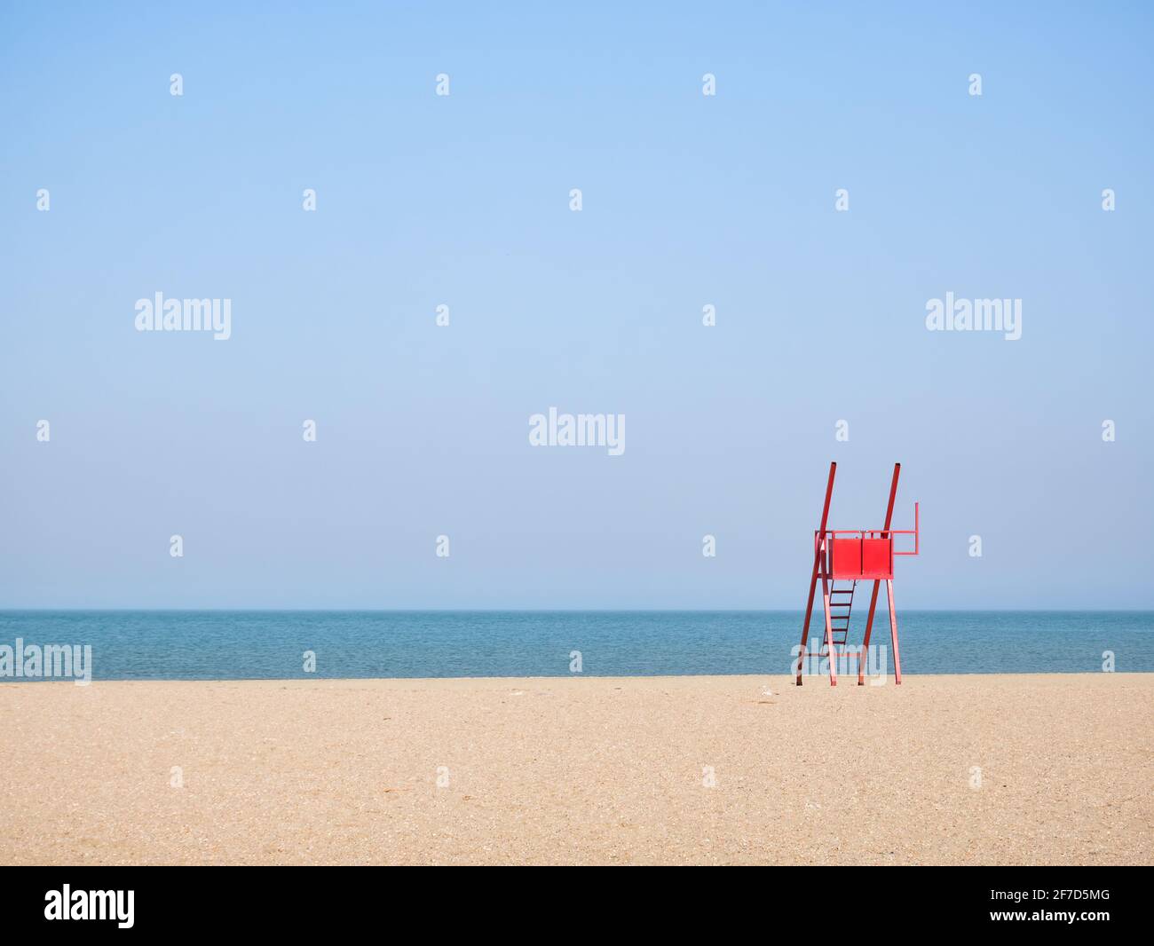 Red lifeguard chair on an empty beach Stock Photo - Alamy