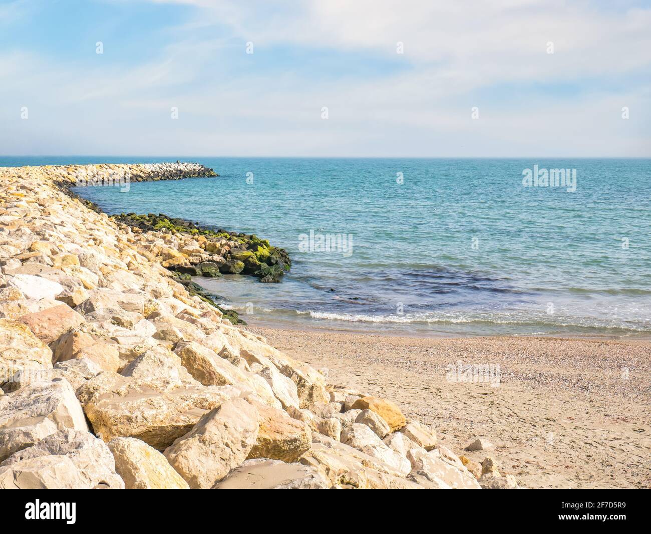 Riprap or rock armour structure for protecting the sea coastline. Black ...