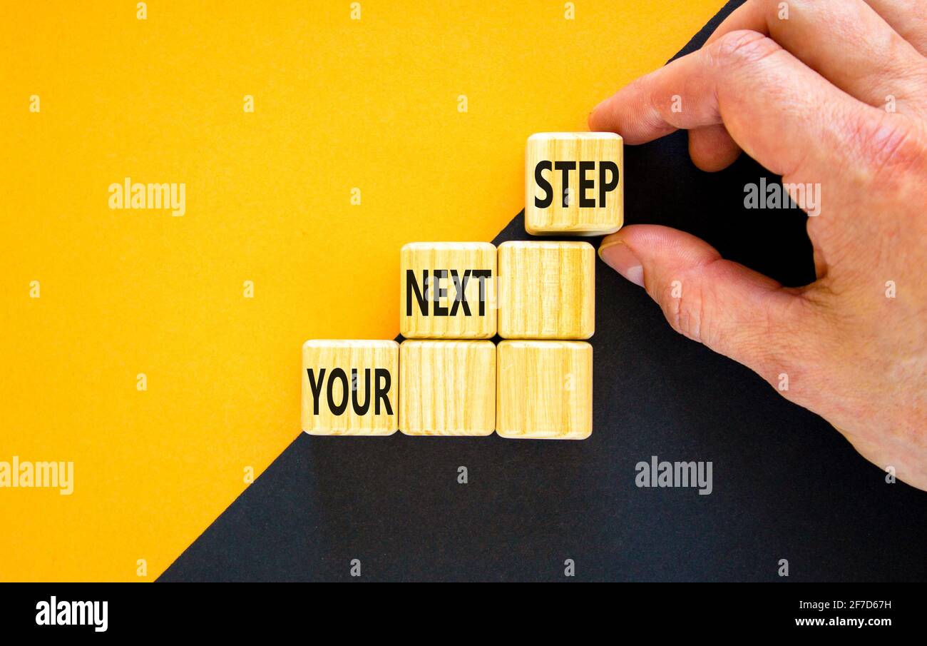 Your next step symbol. Hand arranging wood block stacking as step stair ...