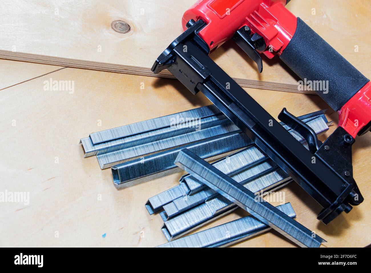 concept of furniture production and repair. Stapler and staples ...
