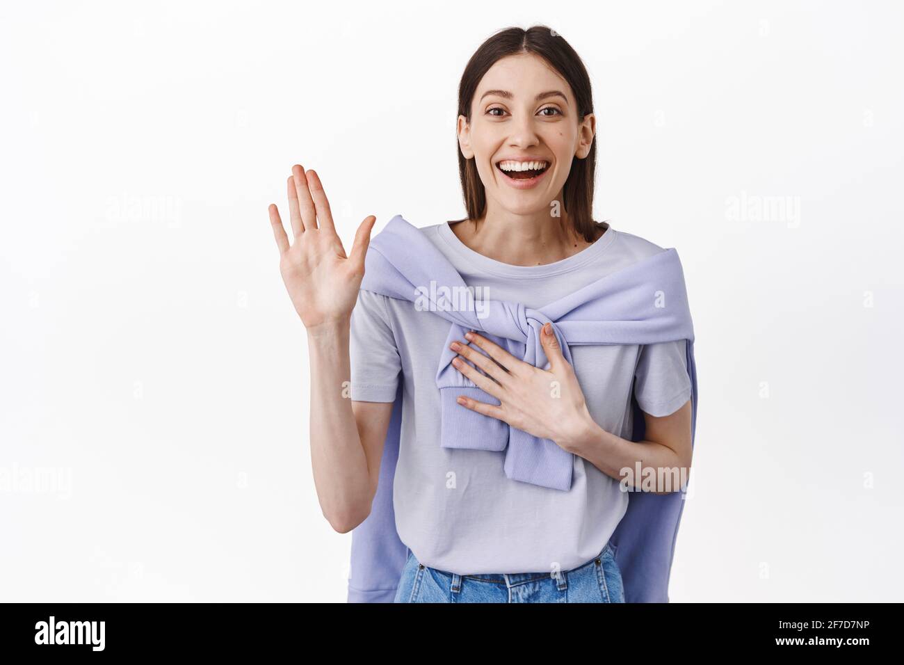Its me, hello. Friendly happy girl raising hand and touching chest ...