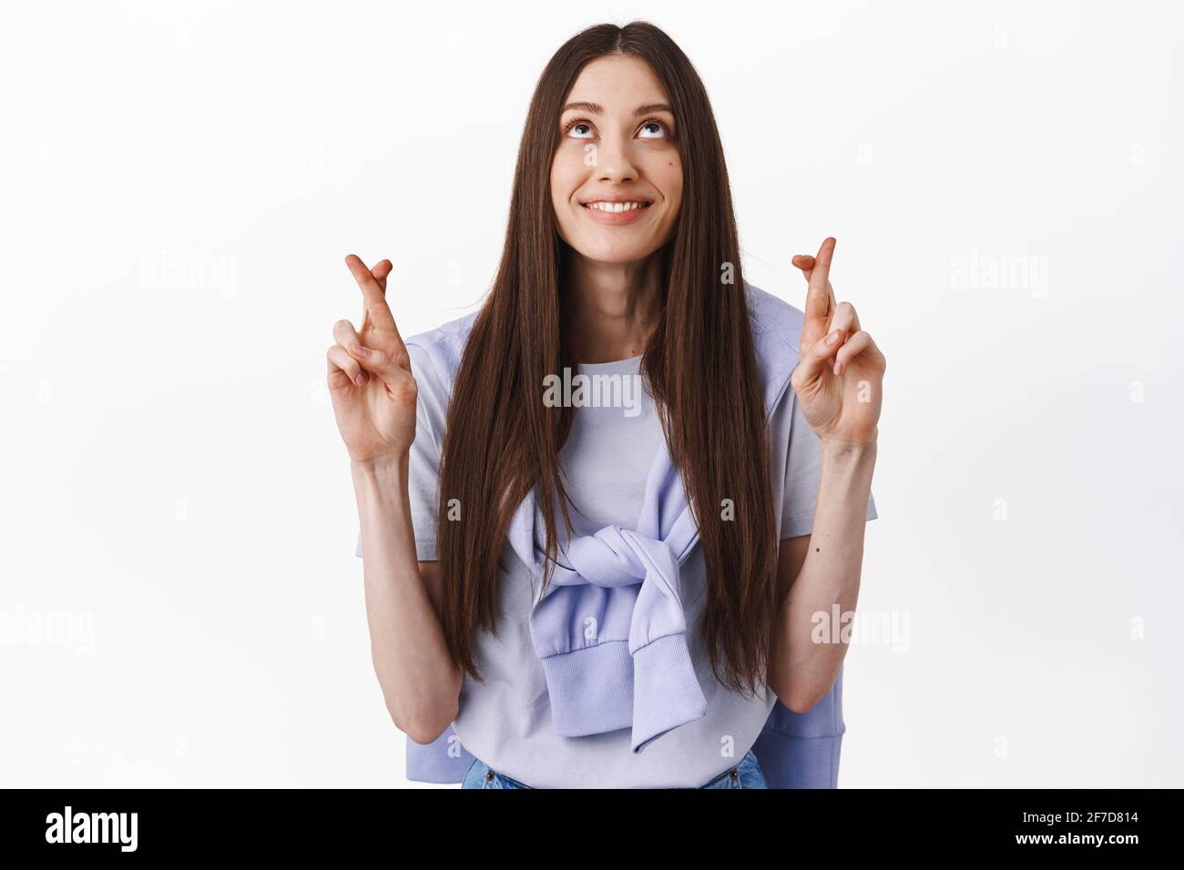 Cute dreamy girl hope, making wish, cross fingers for good luck and ...
