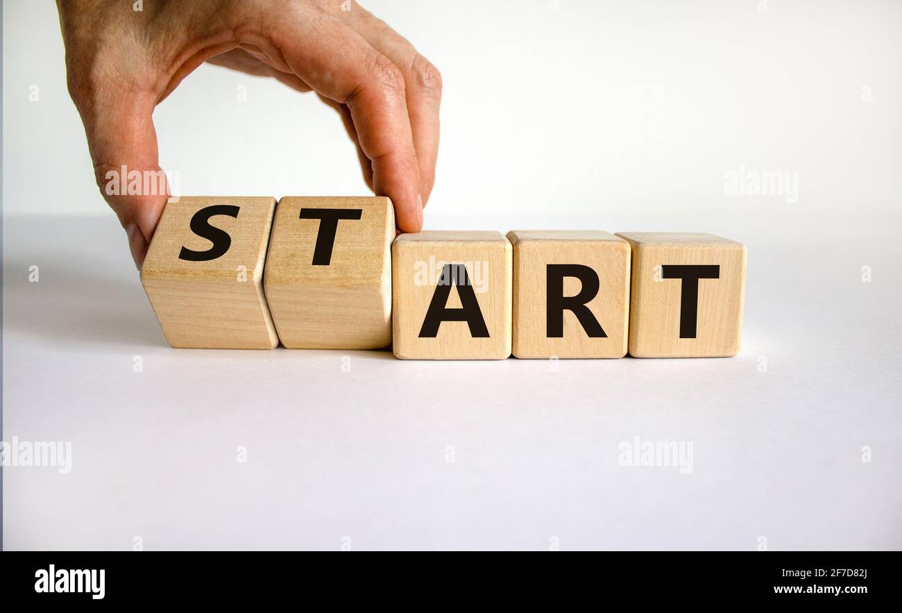 Start art symbol. Businessman turns cubes and changes the word 'start ...