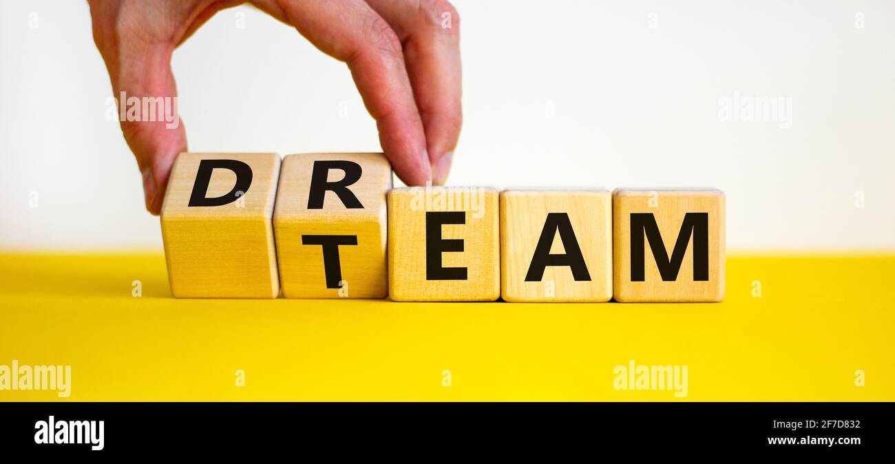 Dream team symbol. Businessman turns cubes and changes the word 'dream ...