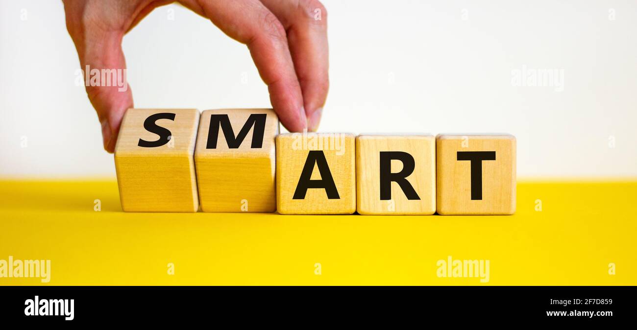Smart art symbol. Businessman turns cubes and changes the word 'smart ...