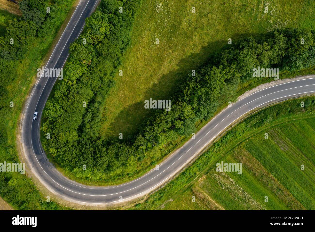 Winding road and dangerous turns, serpentine roads from a bird's eye ...