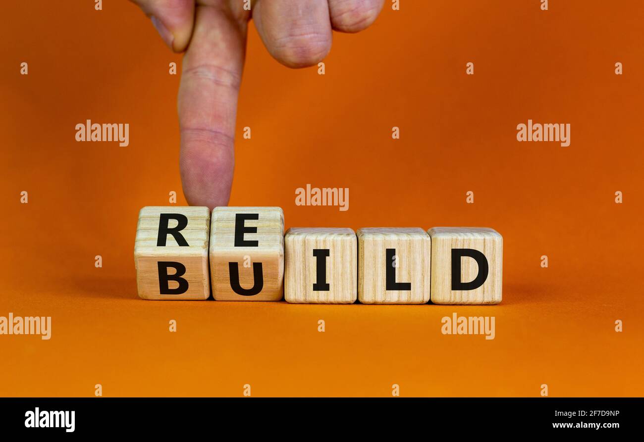 Rebuild symbol. Concept word 'rebuild' on wooden cubes on a beautiful ...
