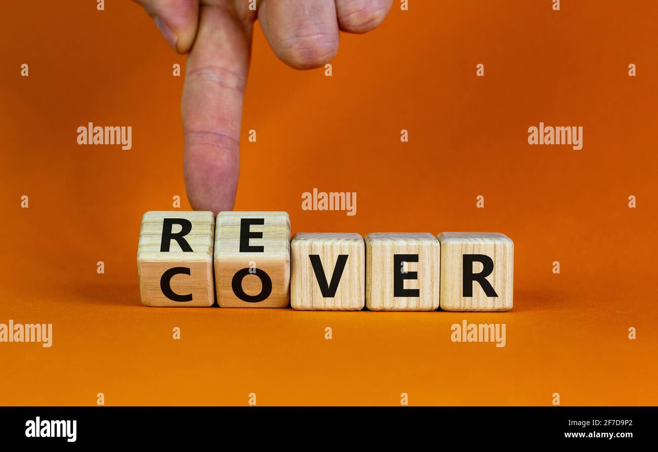 Recover symbol. Concept word 'recover' on wooden cubes on a beautiful ...