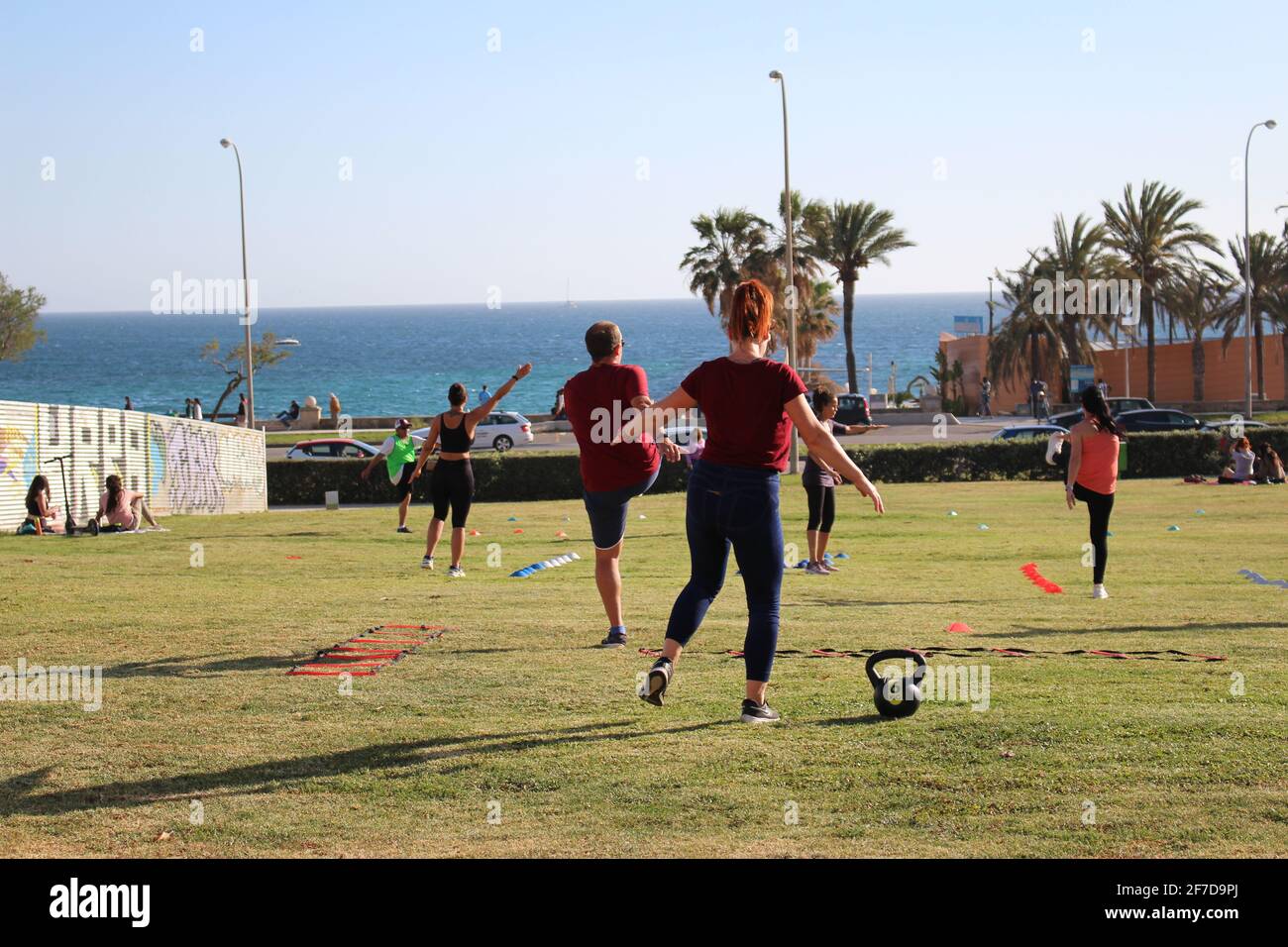 Exercise class in front of the sea Stock Photo - Alamy