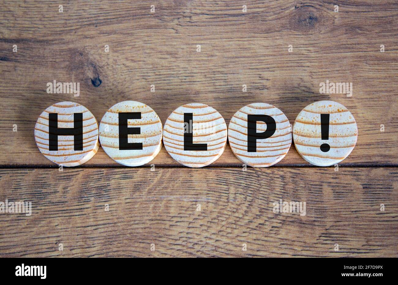 Support and help symbol. Wooden circles with the word 'help'. Business ...
