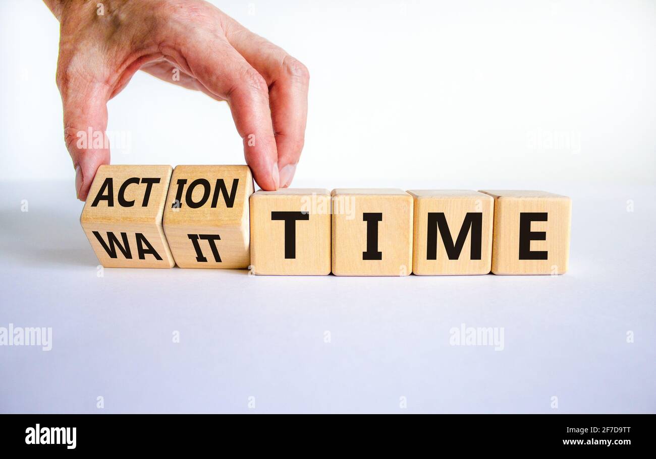 Action or wait time symbol. Businessman turns wooden cubes and changes ...