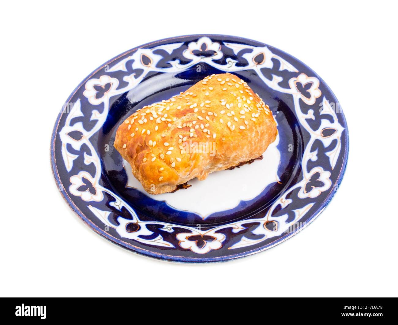 Traditional uzbek samsa bun with minced veal. Served on authentic ...