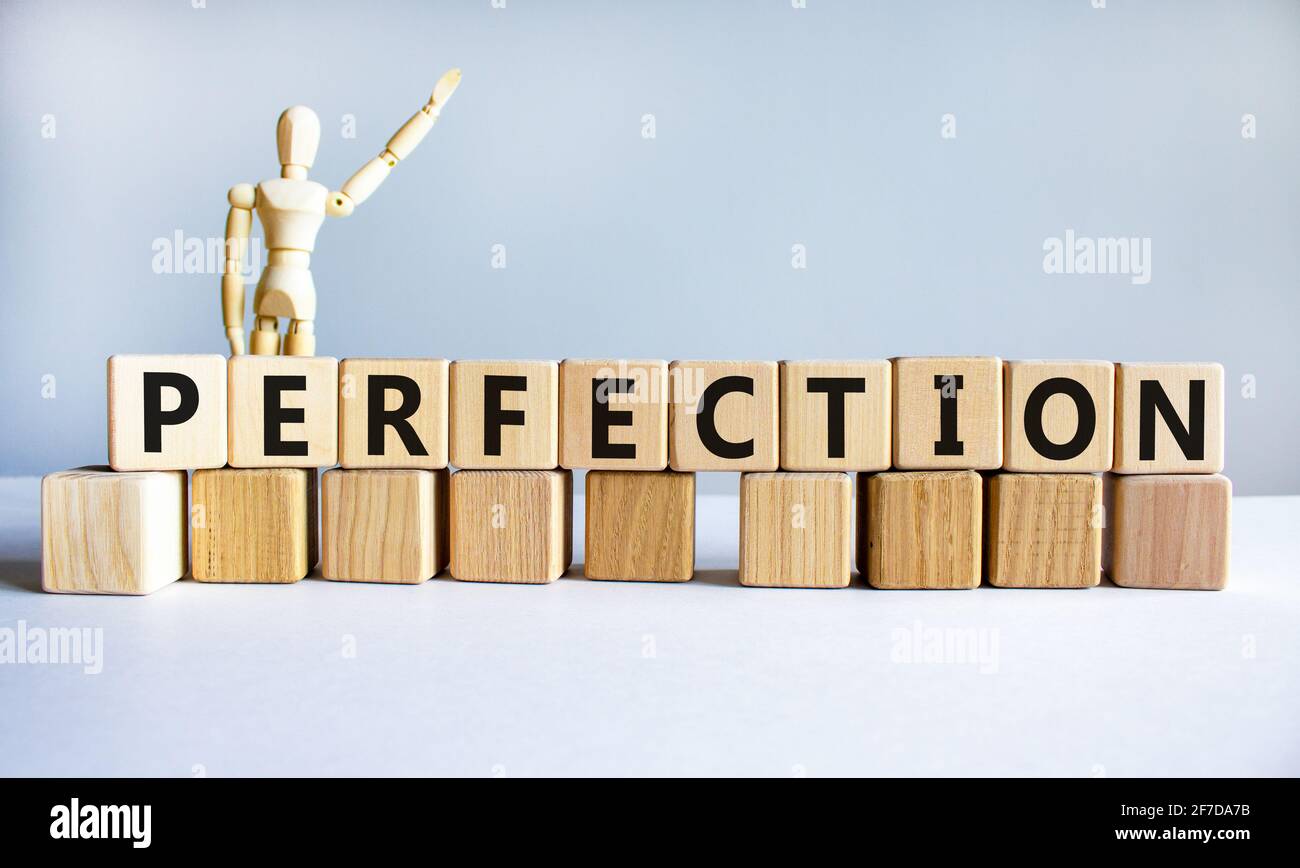 Perfection symbol. Wooden cubes with the word 'perfection'. Wooden ...
