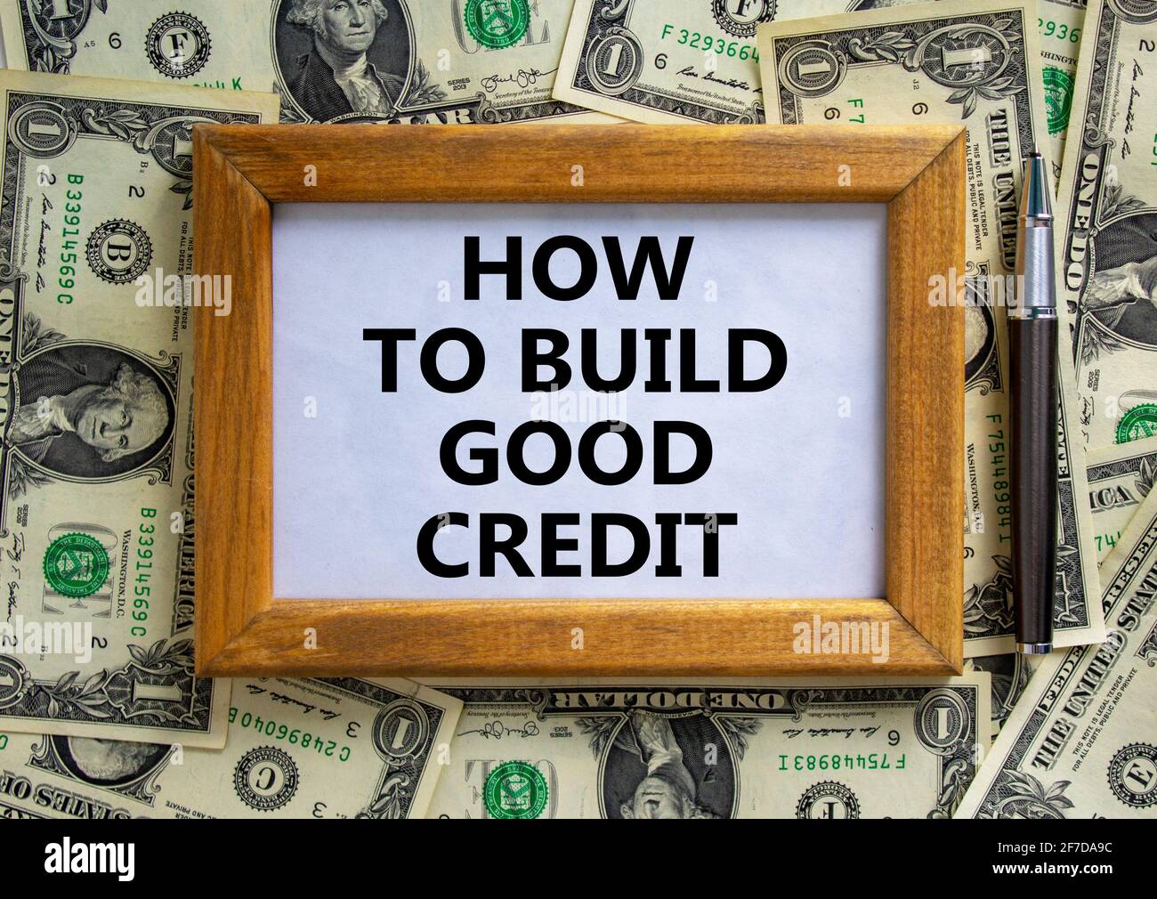 How to build good credit symbol. Wooden frame with words 'how to build ...