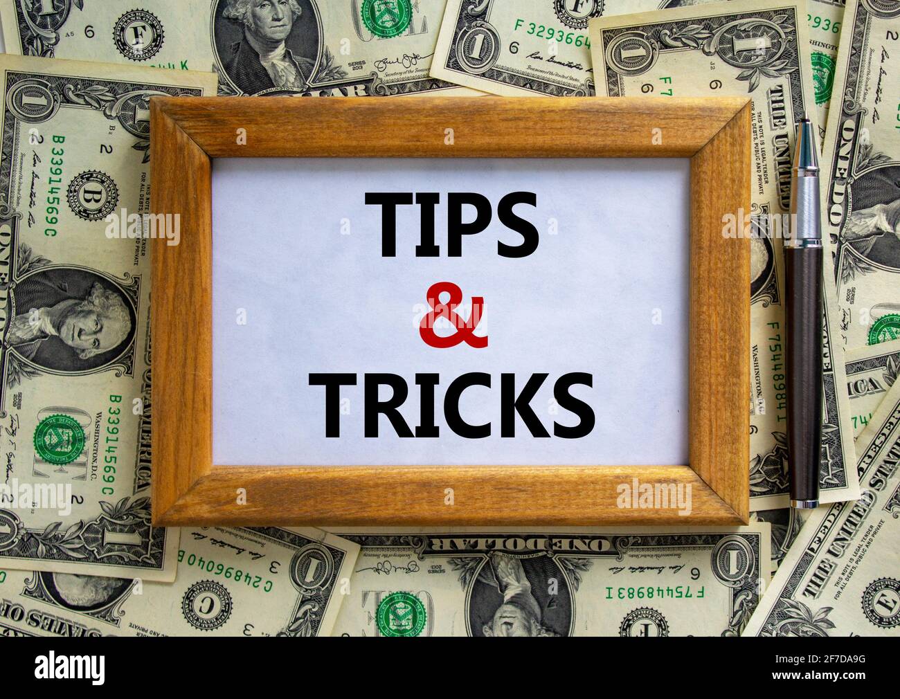Tips and tricks symbol. Wooden frame with words 'Tips and tricks' on ...