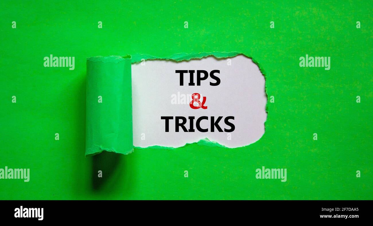 Tips and tricks symbol. Words 'Tips and tricks' appearing behind torn ...