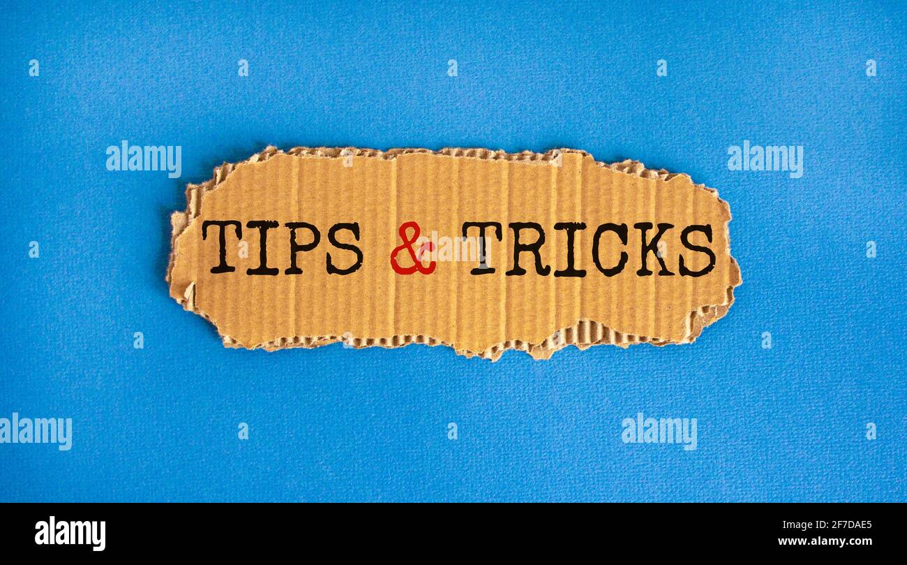 Tips and tricks symbol. Words 'Tips and tricks' on brown paper ...