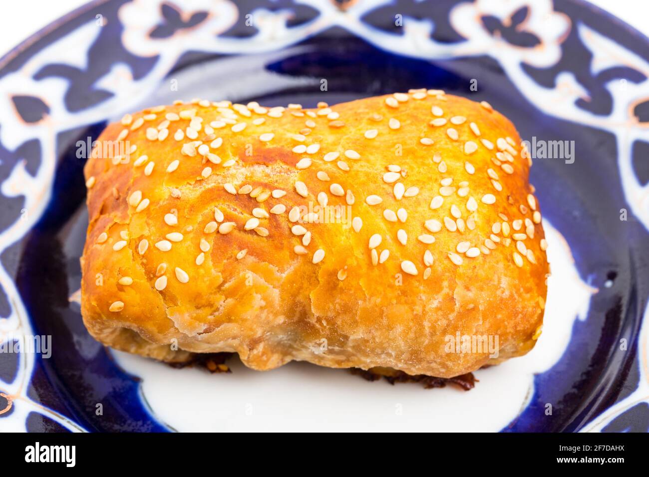 Traditional uzbek samsa bun with minced veal. Served on authentic ...