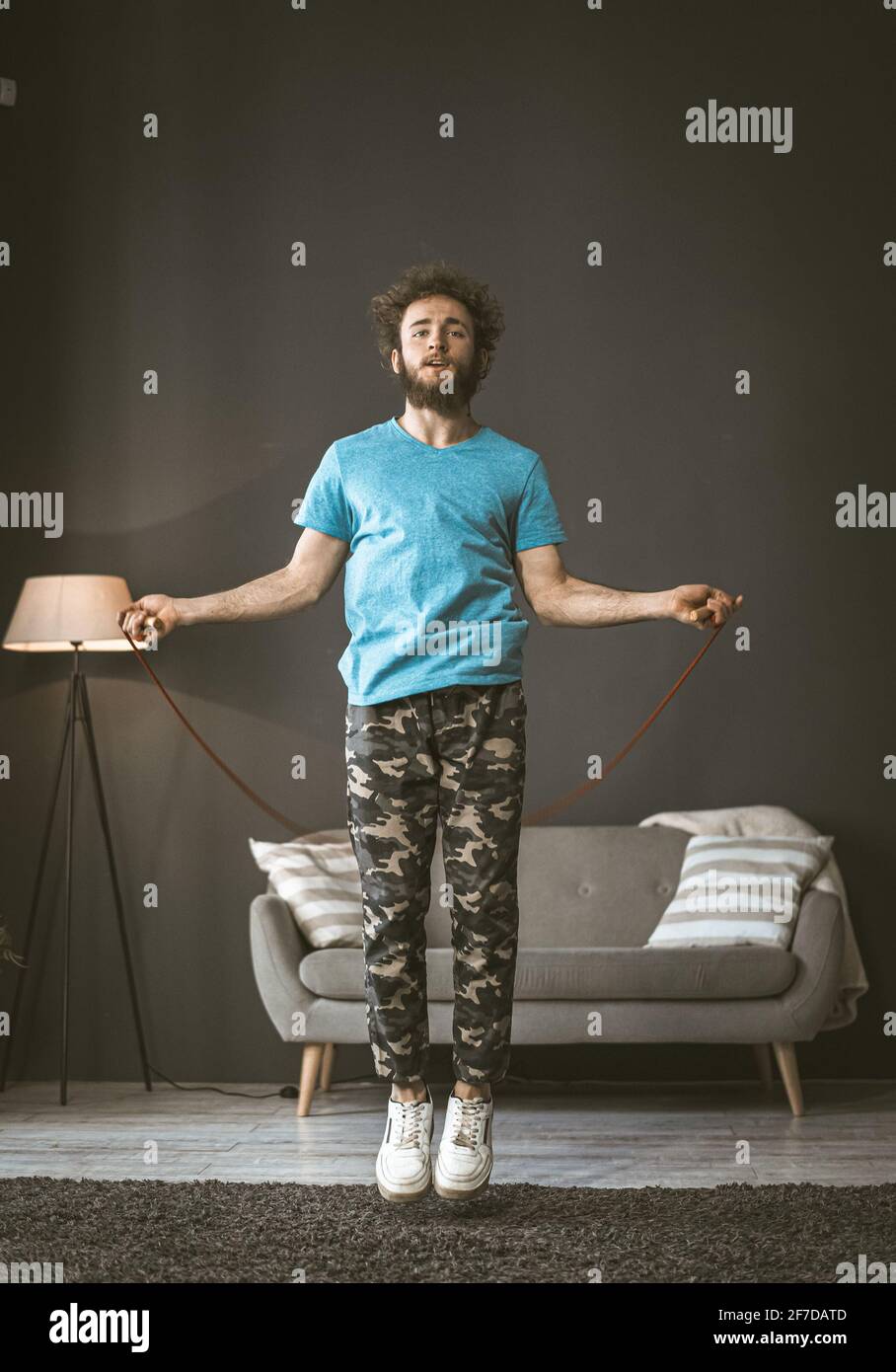 Strong muscular man jumps rope hi-res stock photography and images - Alamy