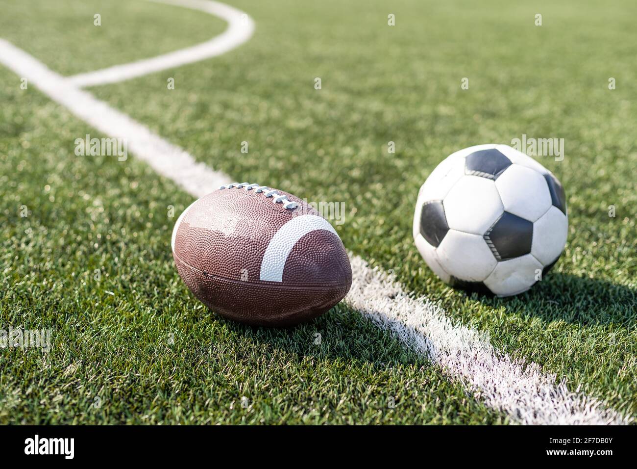soccer field and stadium, rugby ball and soccer ball at the stadium ...