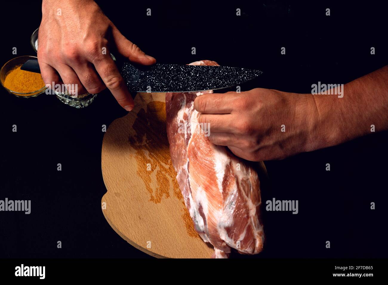 The cook cuts the fat on the neck, prepares the meat for marinating and ...