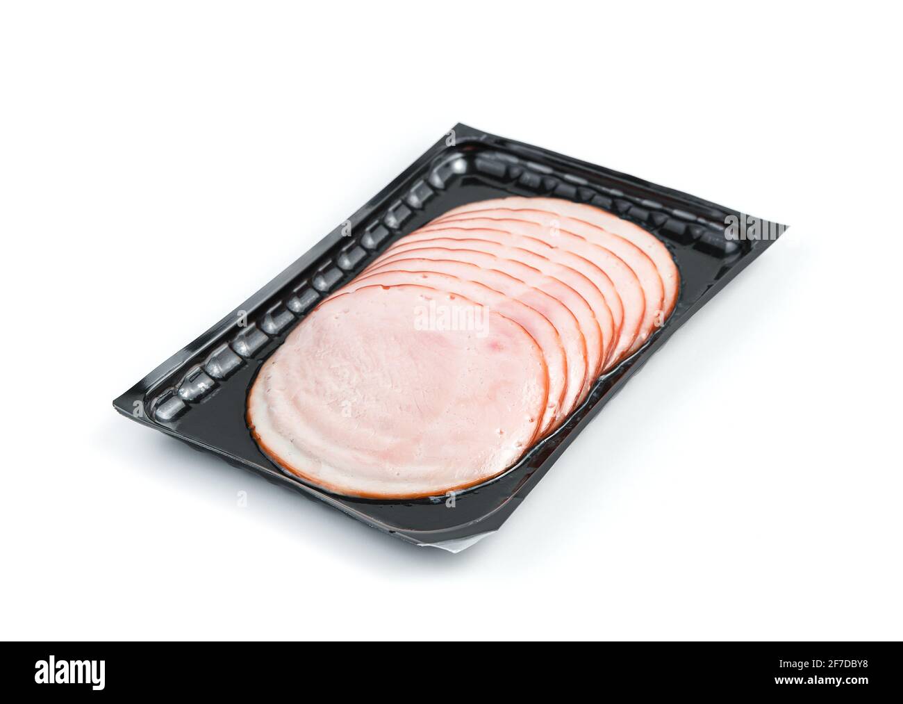 Turkey ham in vacuum packaging, isolated on a white background. Side ...