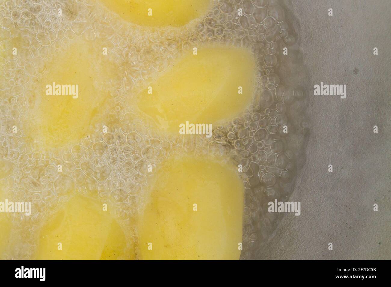 Golden potatoes are fried in boiling oil in a cauldron Stock Photo - Alamy