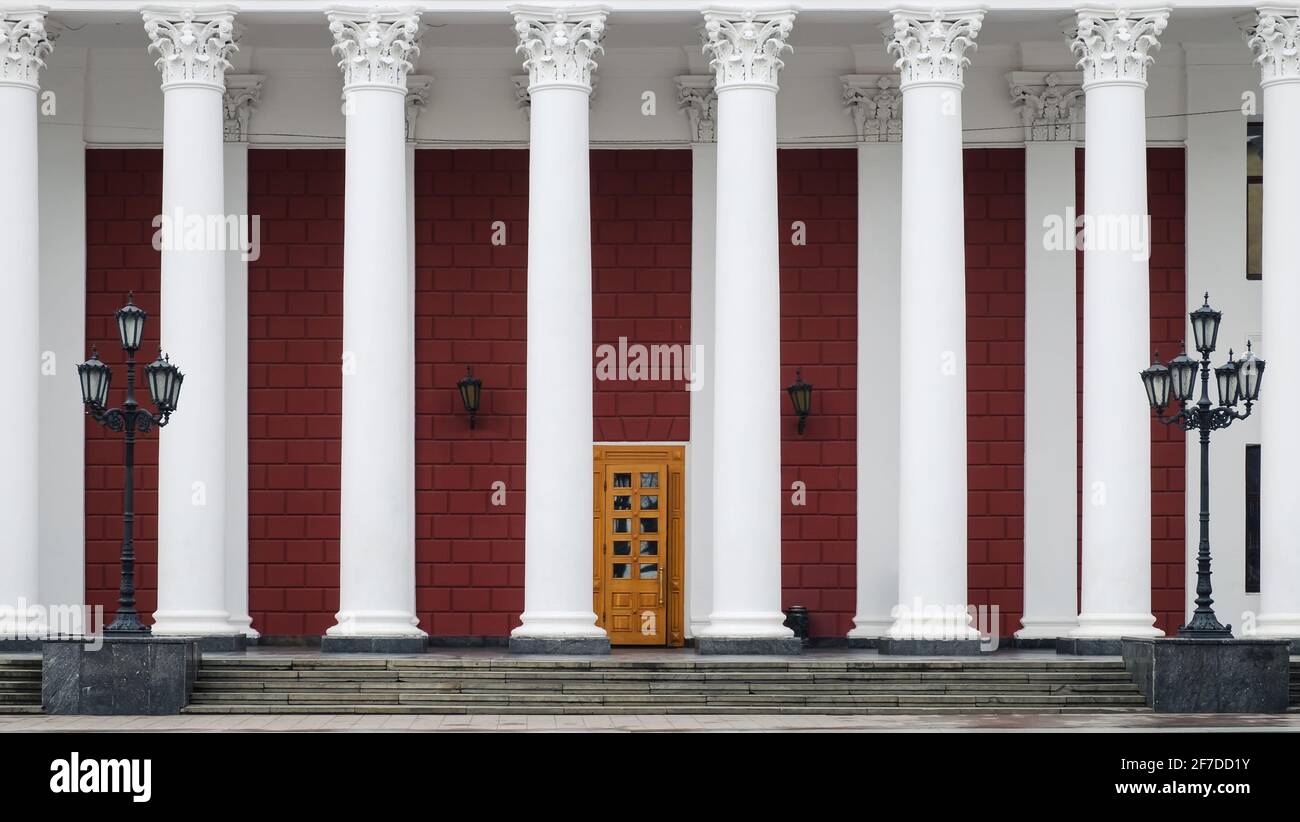 Old architecture building facade with large white columns and steps ...