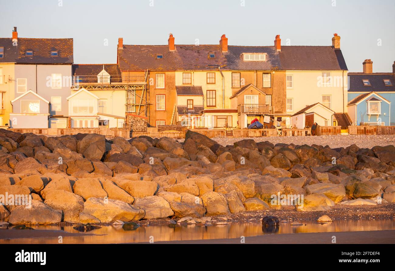 Sea defences, and houses along High Street,in,Borth,at sunset.Borth ...