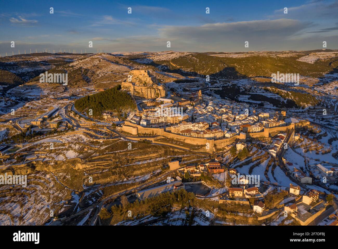 Morella medieval city aerial view, in a winter sunset, after a snowfall ...