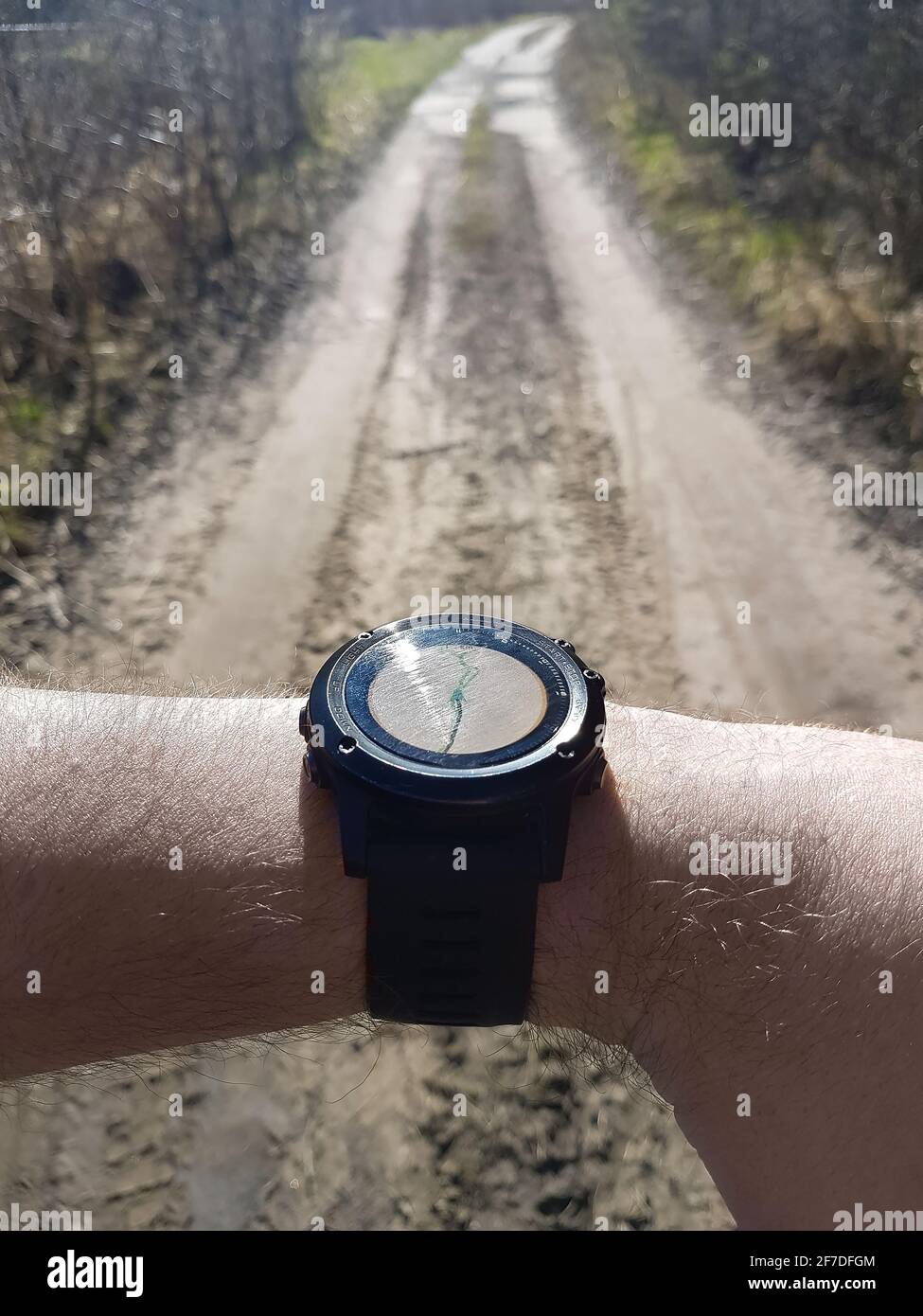 Smart watch show the direction of the route on the forest road Stock ...