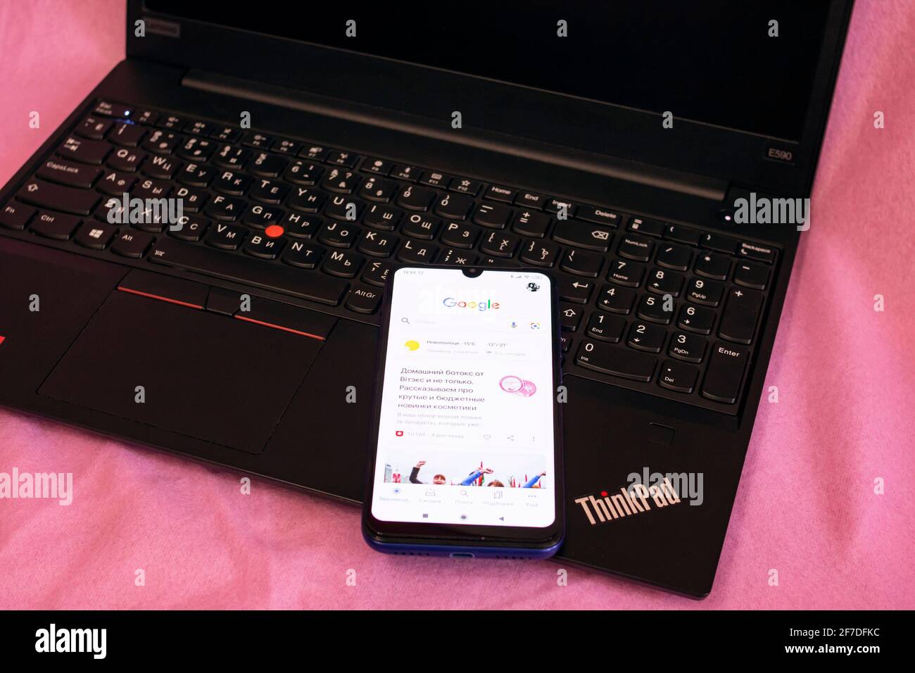 NOVOPOLOTSK, BELARUS - 06 FEBRUARY, 2021: Phone in hand and google logo ...