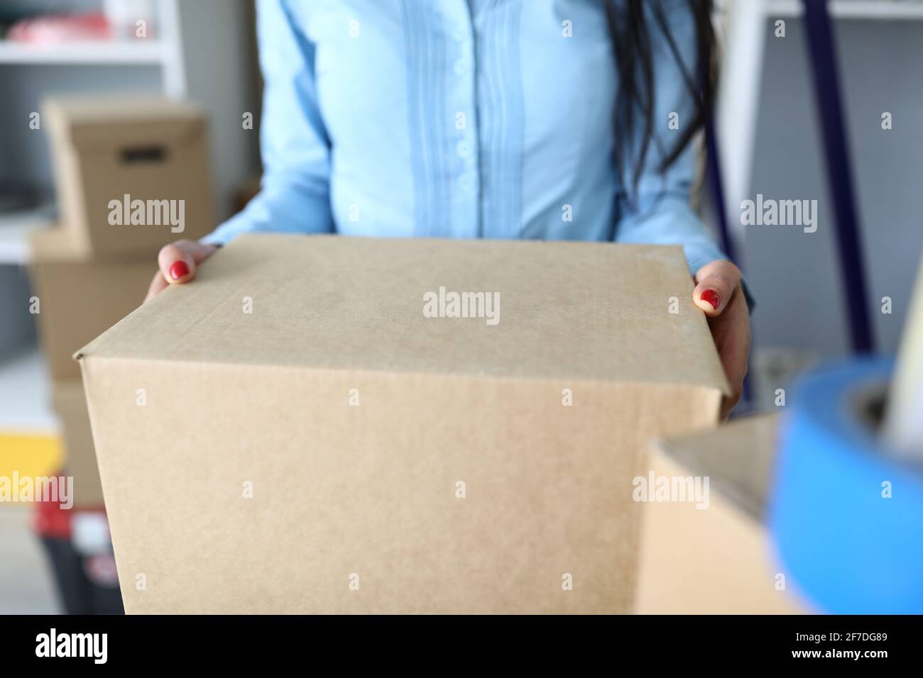 Woman carrying furniture hi-res stock photography and images - Alamy