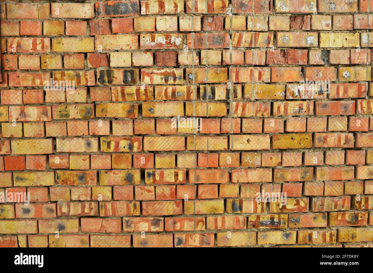 Poor quality brickwork from low quality damaged bricks Stock Photo - Alamy