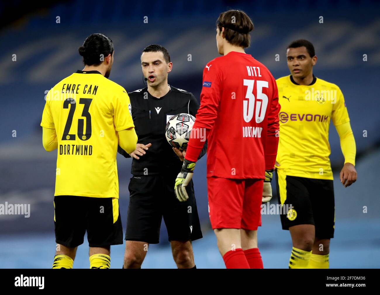 Referee Ovidiu Alin Hategan speaks to Borussia Dortmund's Emre Can ...