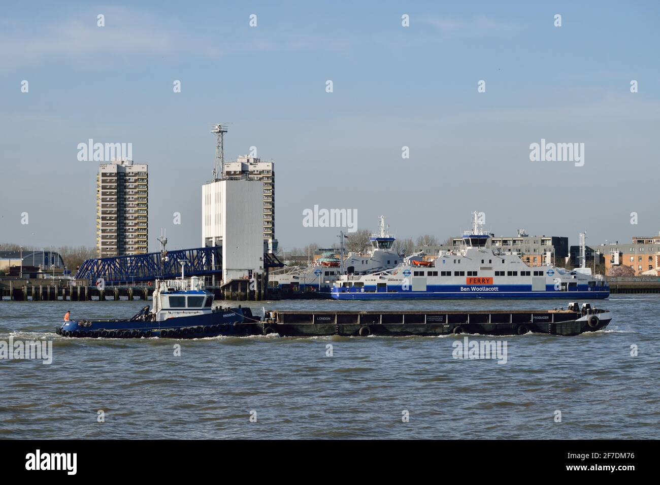 Small tug pushing a barge down the River Thames in London Stock Photo ...