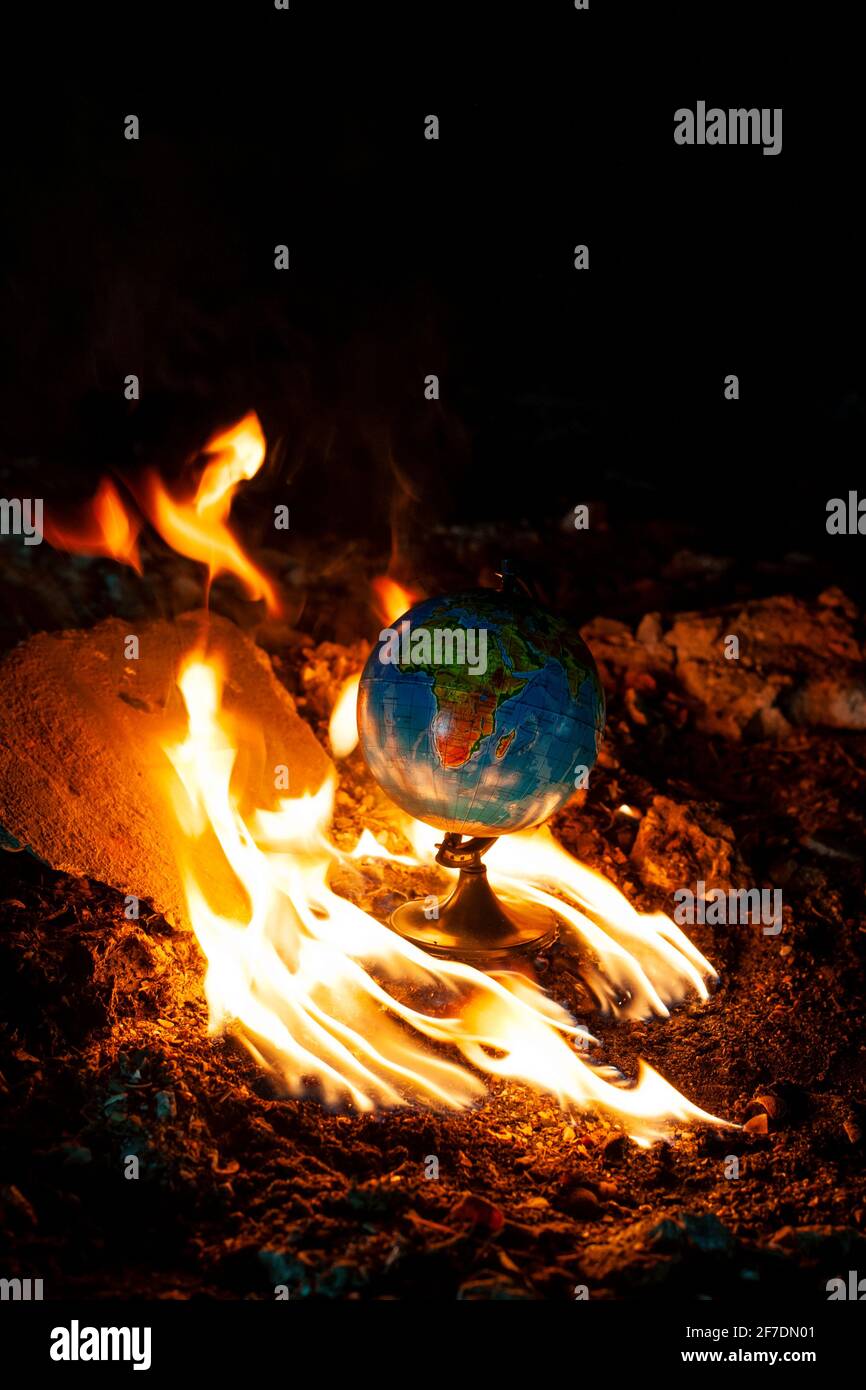 Globe in fire circle in abandoned space. Parallel to 2020 year Stock ...